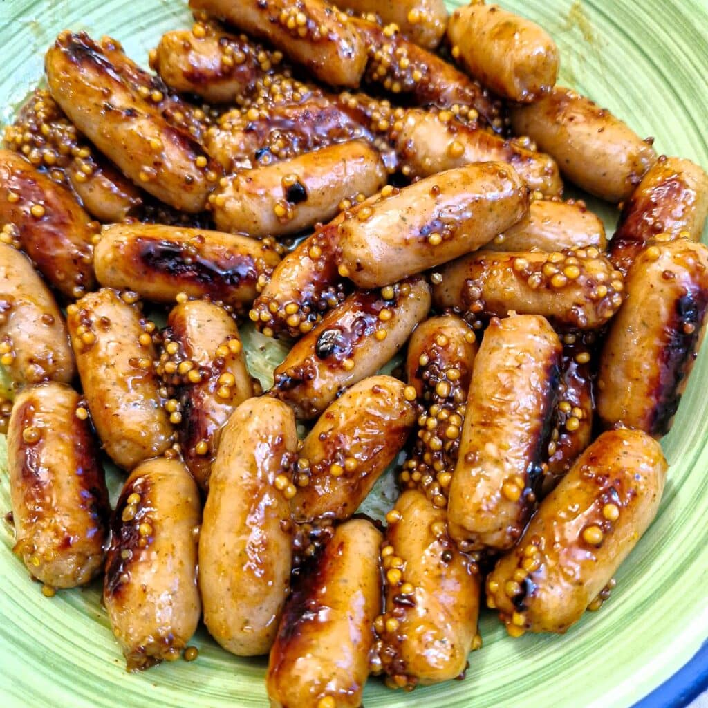 Sticky cocktail sausages with tangy glaze - Foodle Club